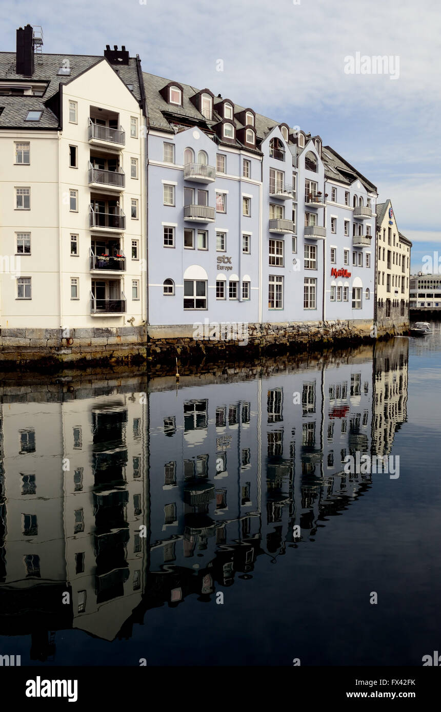 Reflection of waterside buildings in the centre of Alesund Stock Photo ...