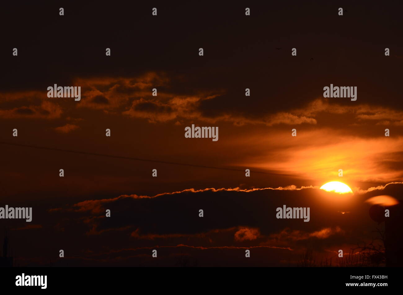 Beautiful sunset above the heavens gold sunny scene Stock Photo - Alamy