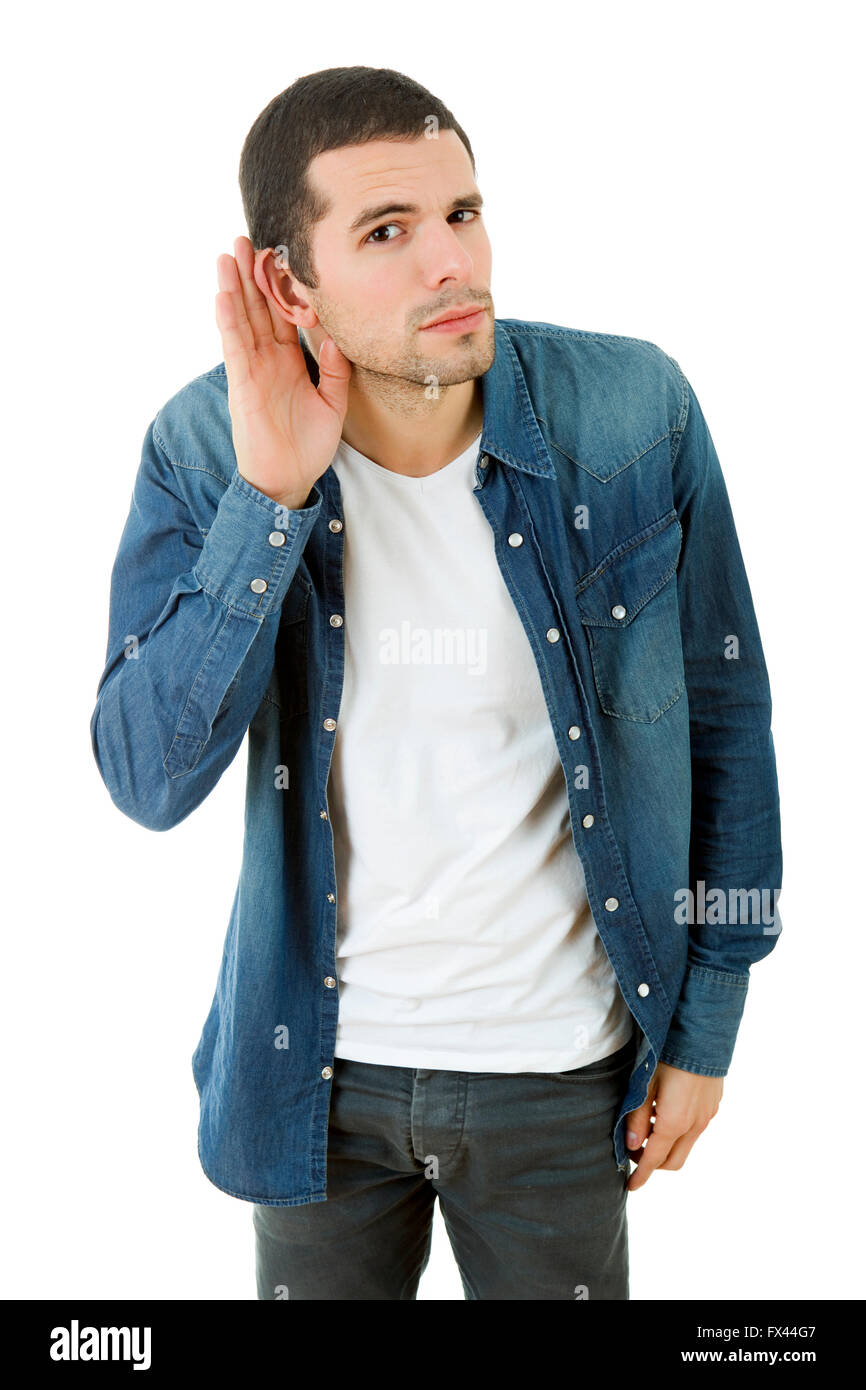 young casual man listening in white background Stock Photo - Alamy