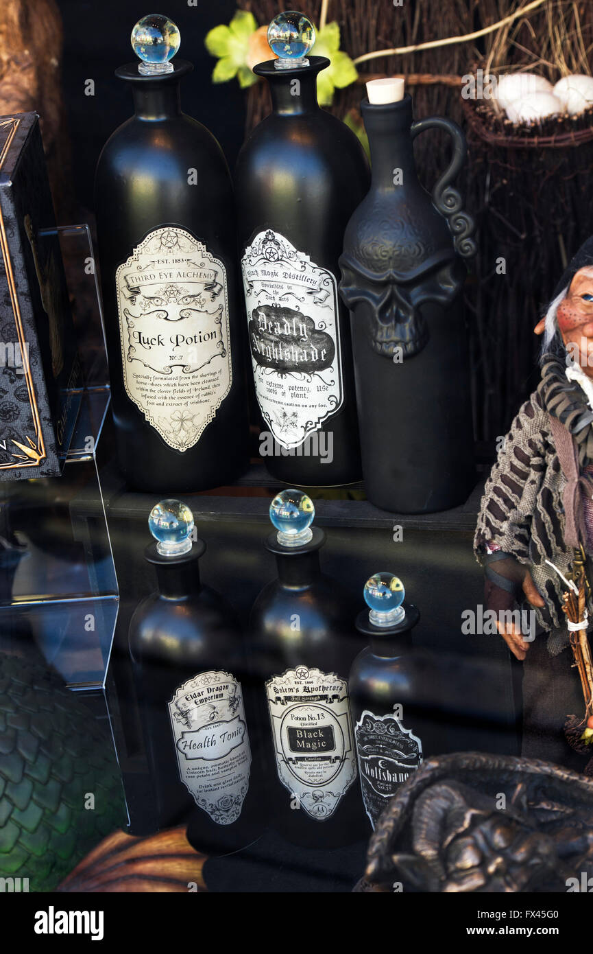 Potion and tonic bottles in a shop window. Glastonbury, Somerset ...
