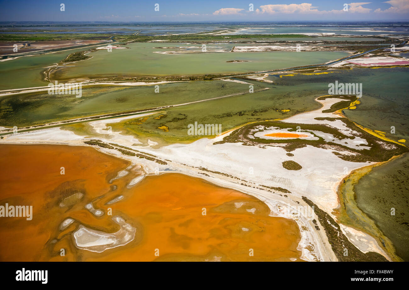 Aerial, salt flowers on the surfaces of the salt works, marshlands and ...