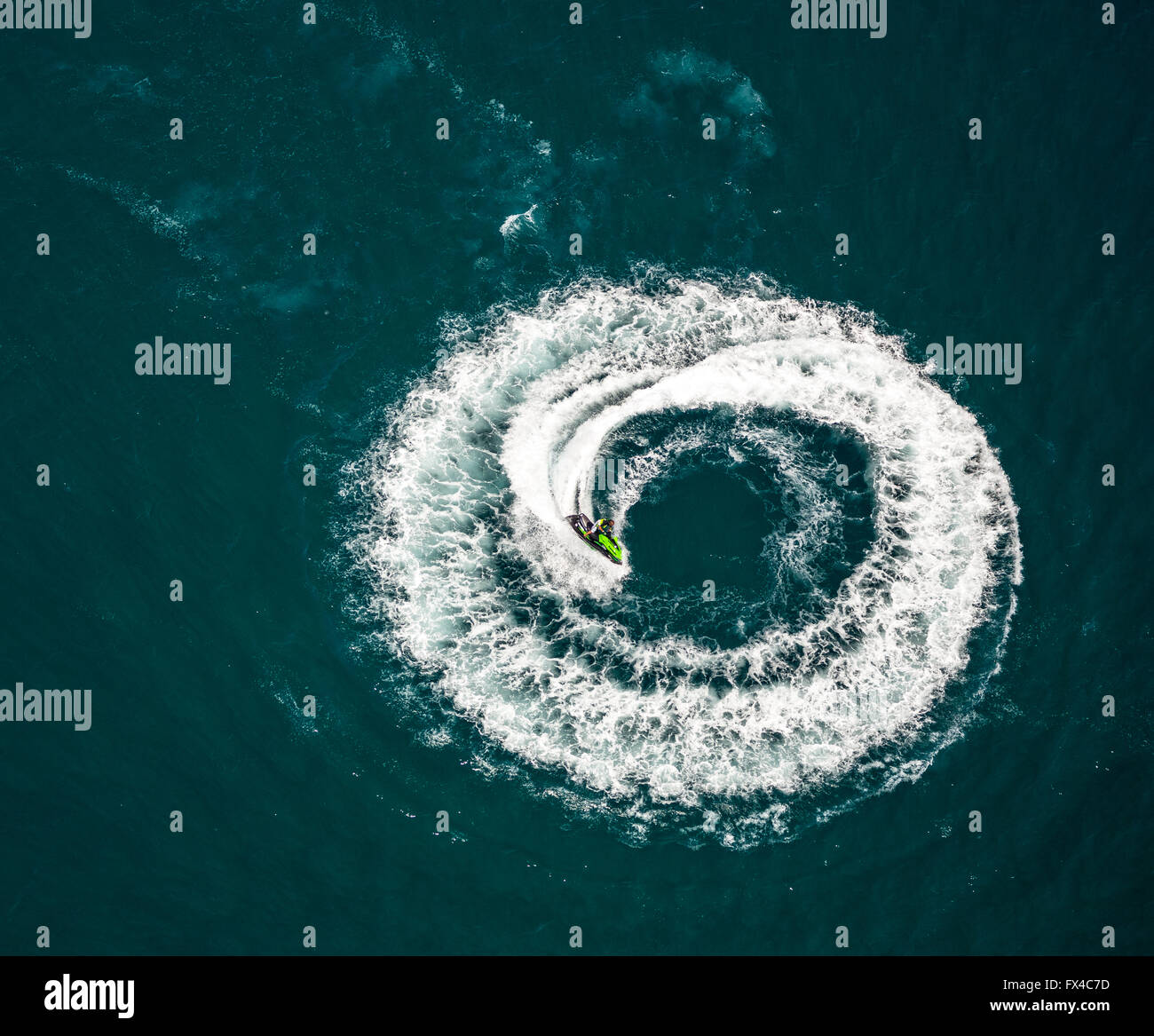 Aerial view, jet moves in a circle, circle drive, green jet skiing ...