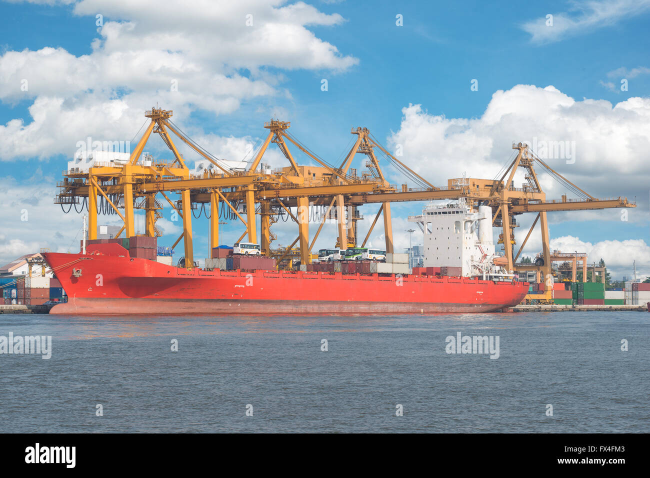 Industrial Container Cargo freight ship with working crane in shipyard ...