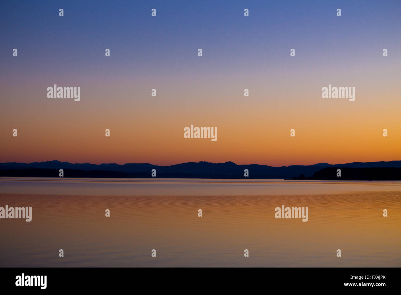 This beautiful sunset over water is photographed in an abstract way to ...