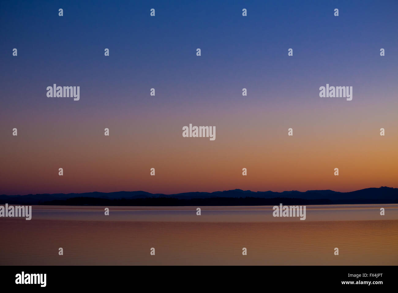 This beautiful sunset over water is photographed in an abstract way to ...