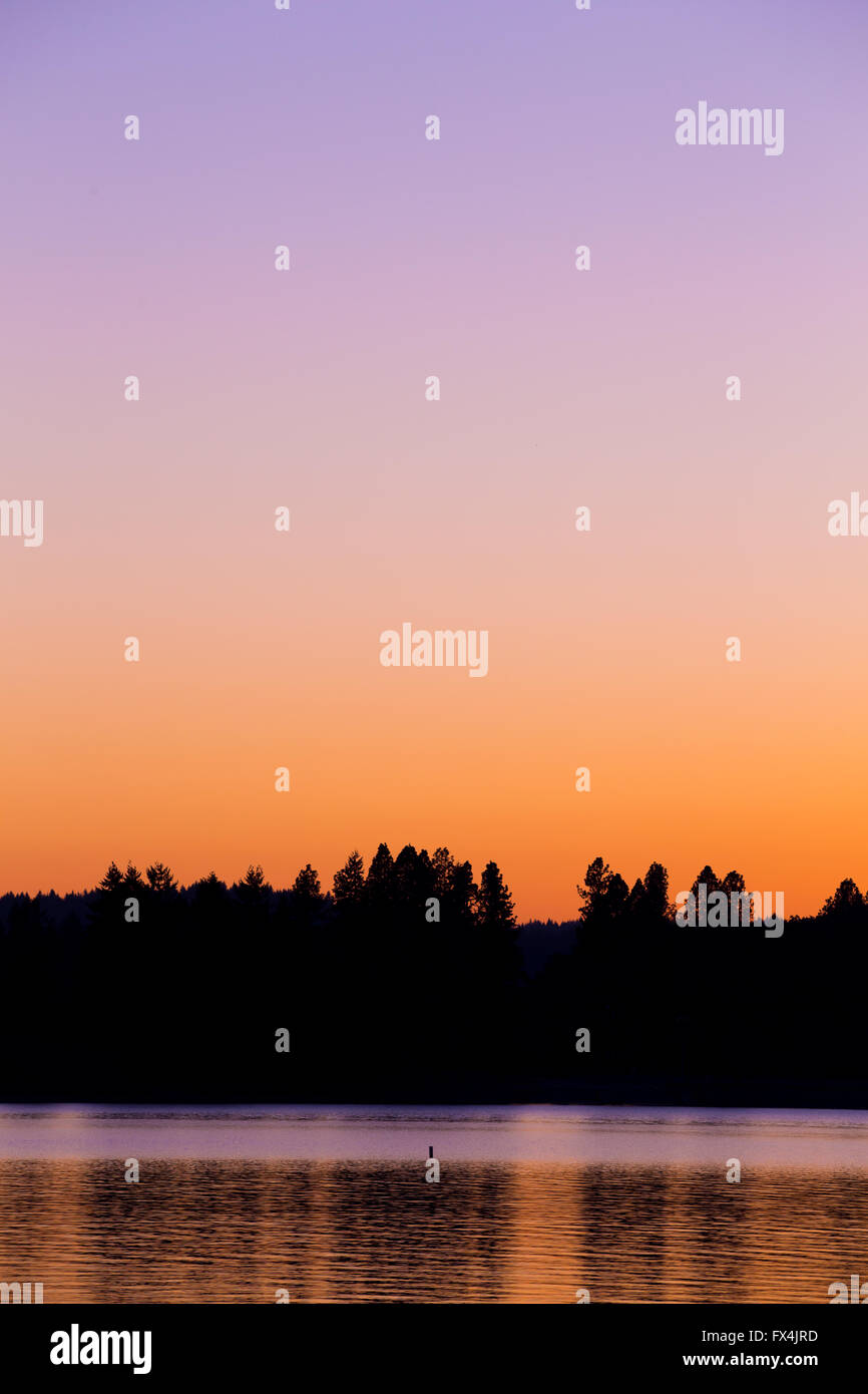 This beautiful sunset over water is photographed in an abstract way to ...