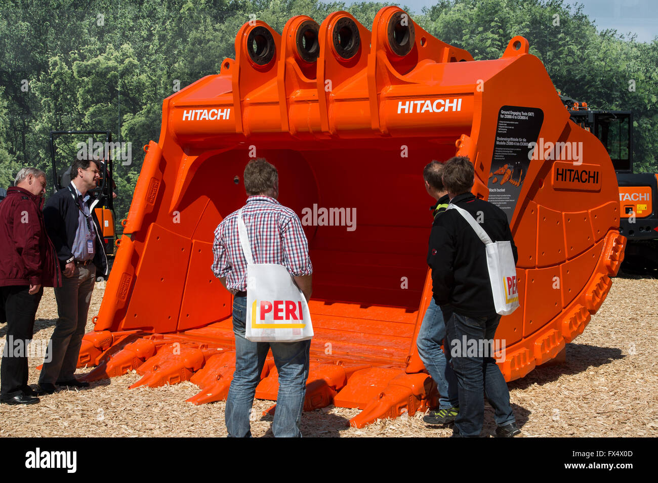 An oversized excavator shovel by Hitachi pictured at the building fair ...