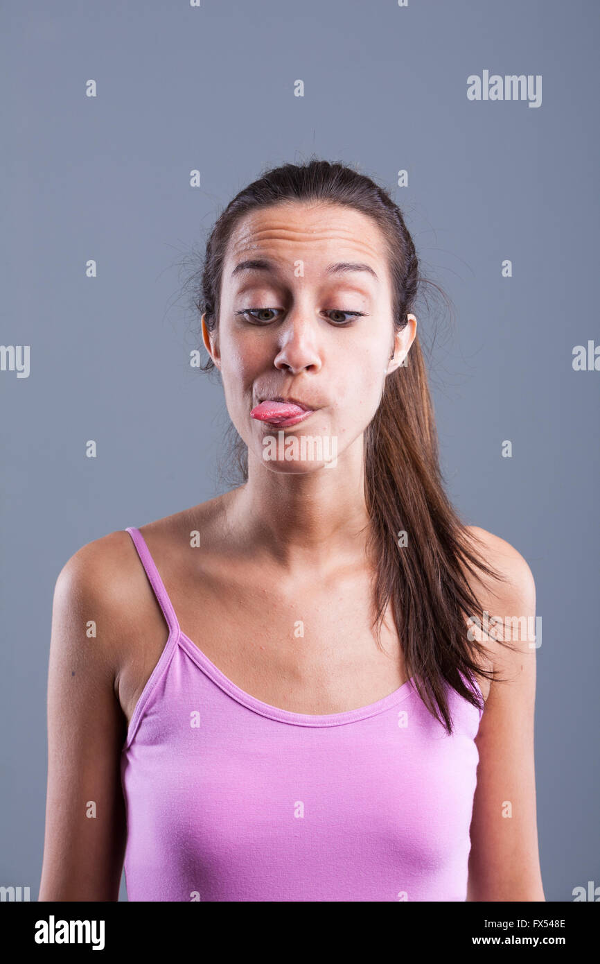 Tongue Stuck Out In A Funny Face Made By This Lovely Funny Girl Stock