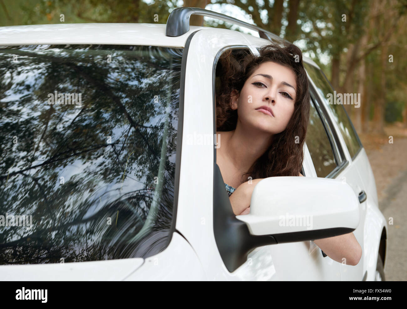 sad girl driver inside car portrait, look into the distance, summer ...