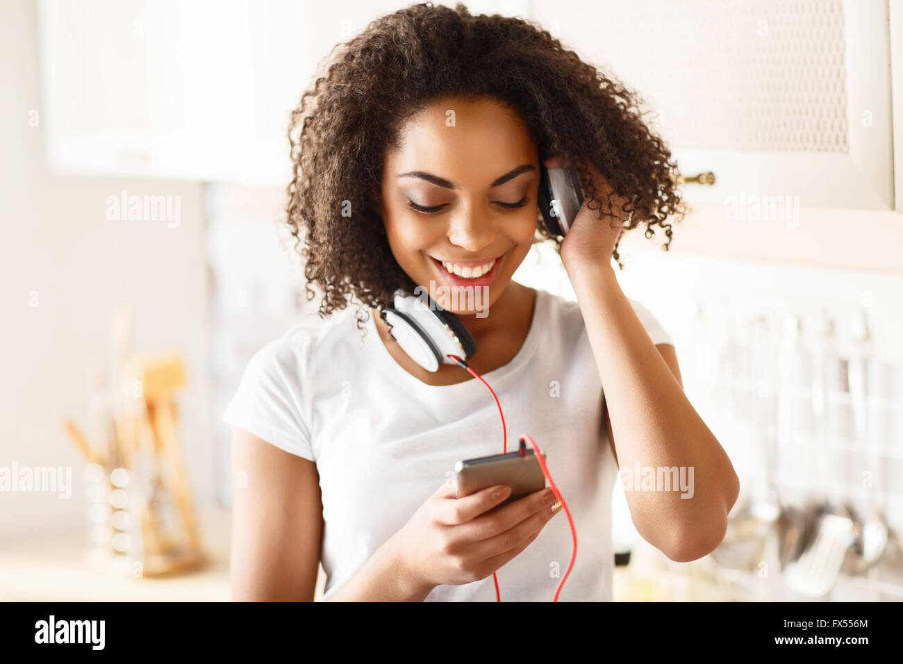 Cheerful pleasant girl listening hi-res stock photography and images ...