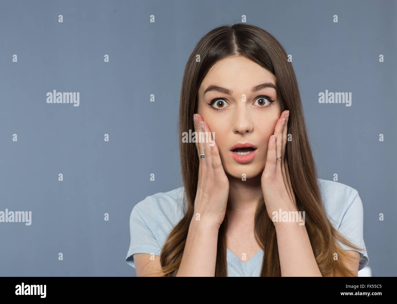 Pleasant girl expressing surprise Stock Photo - Alamy