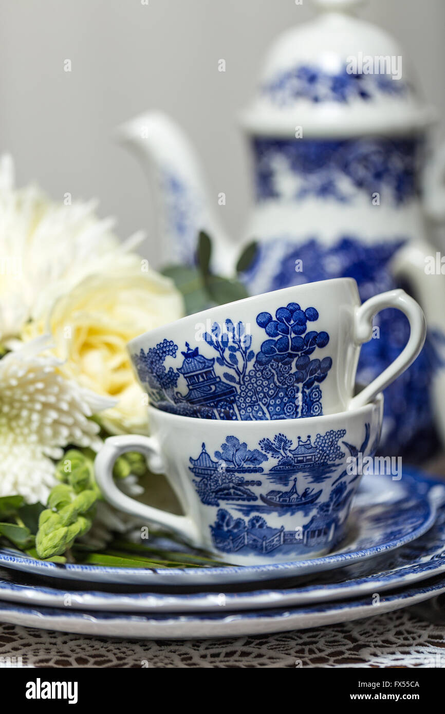 Blue and white transferware Spode willow pattern tea set on lace cloth ...