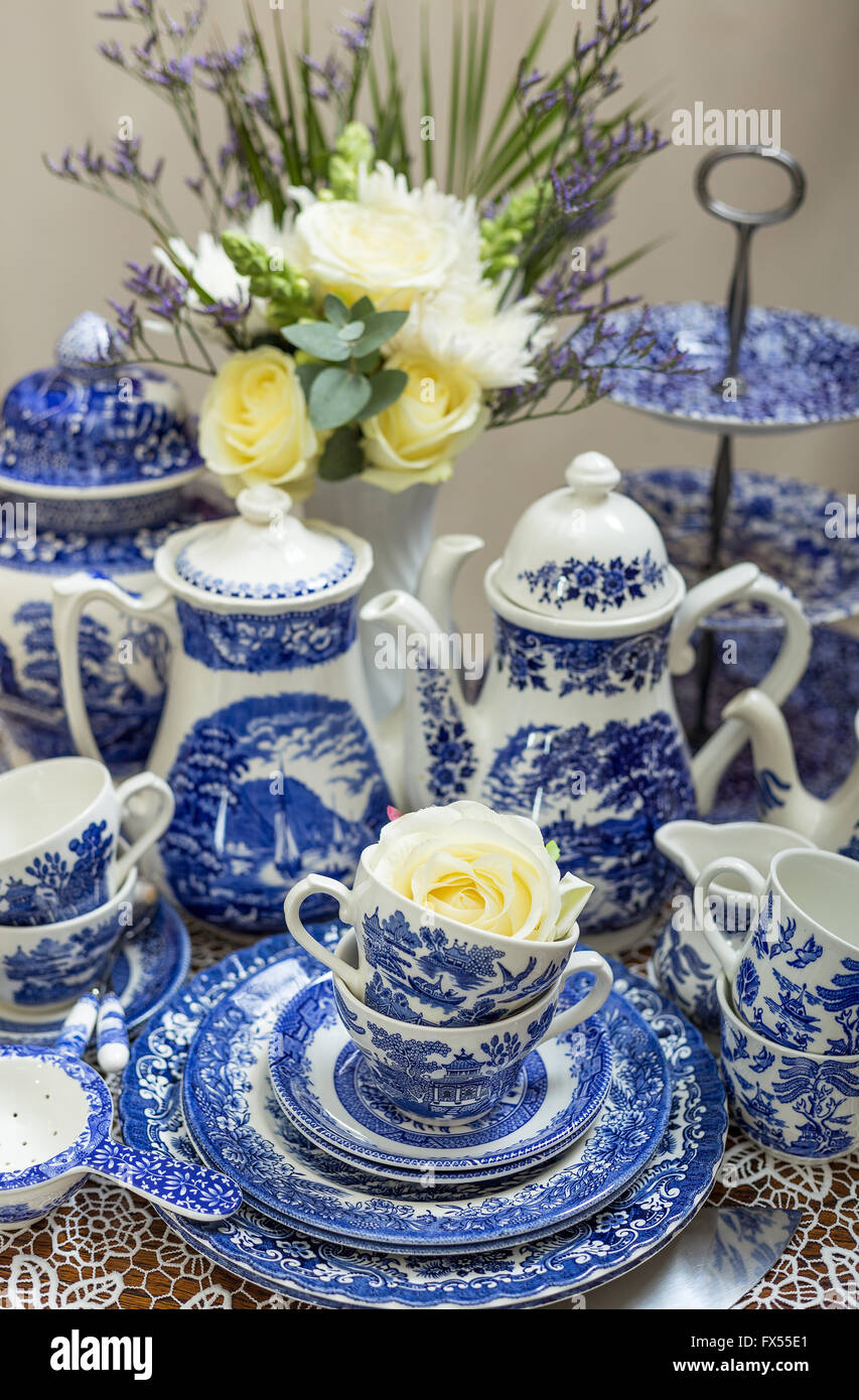Blue and white transferware Spode willow pattern tea set on lace cloth ...