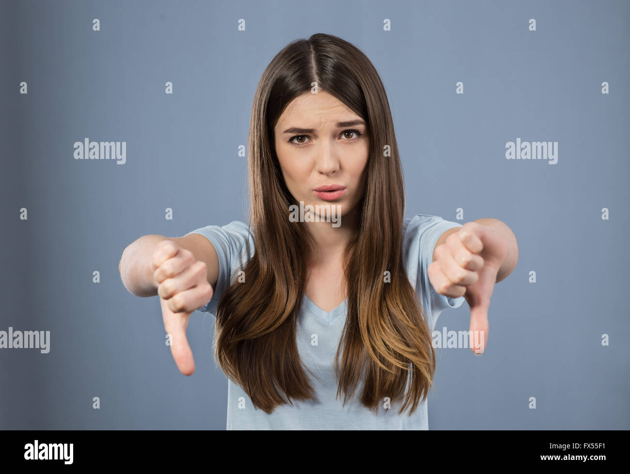 Cheerless girl expressing disagreement Stock Photo - Alamy