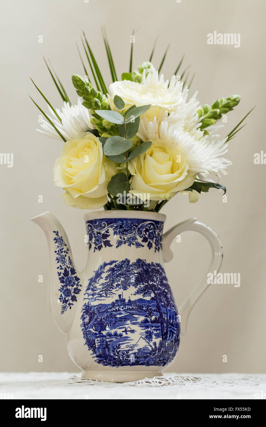 Blue and white transferware Spode willow pattern tea set on lace cloth ...