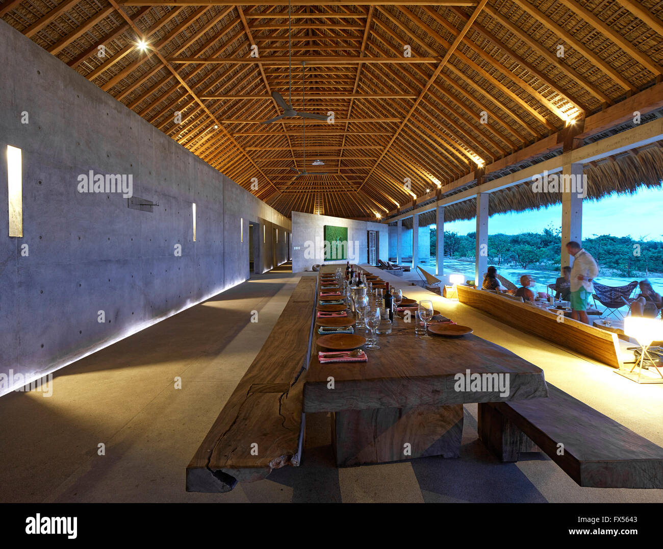 Overall interior view of main Palapa , vast dinning table at dusk. Casa ...