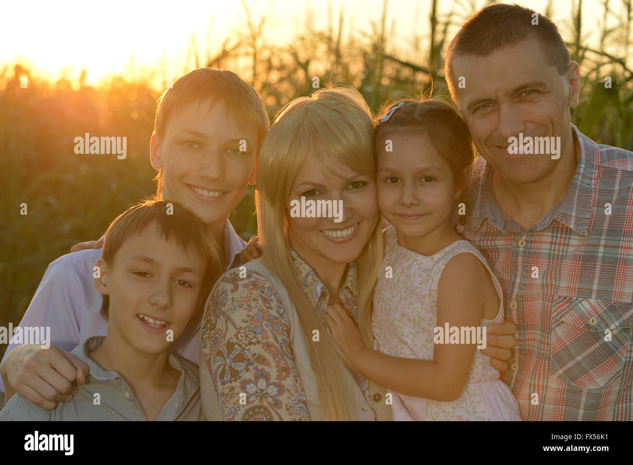 Family having rest in field Stock Photo - Alamy