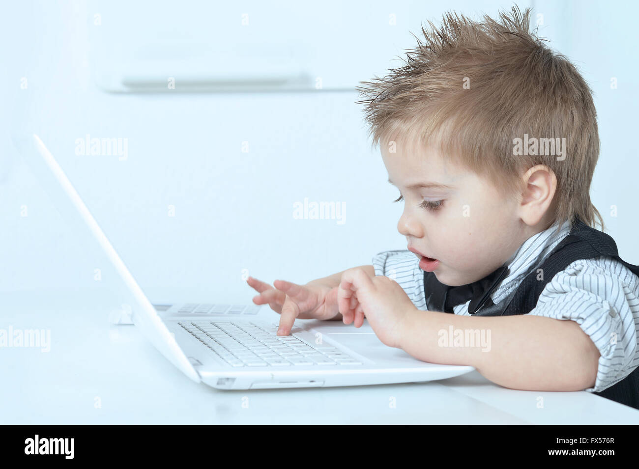 Little boy using laptop Stock Photo - Alamy