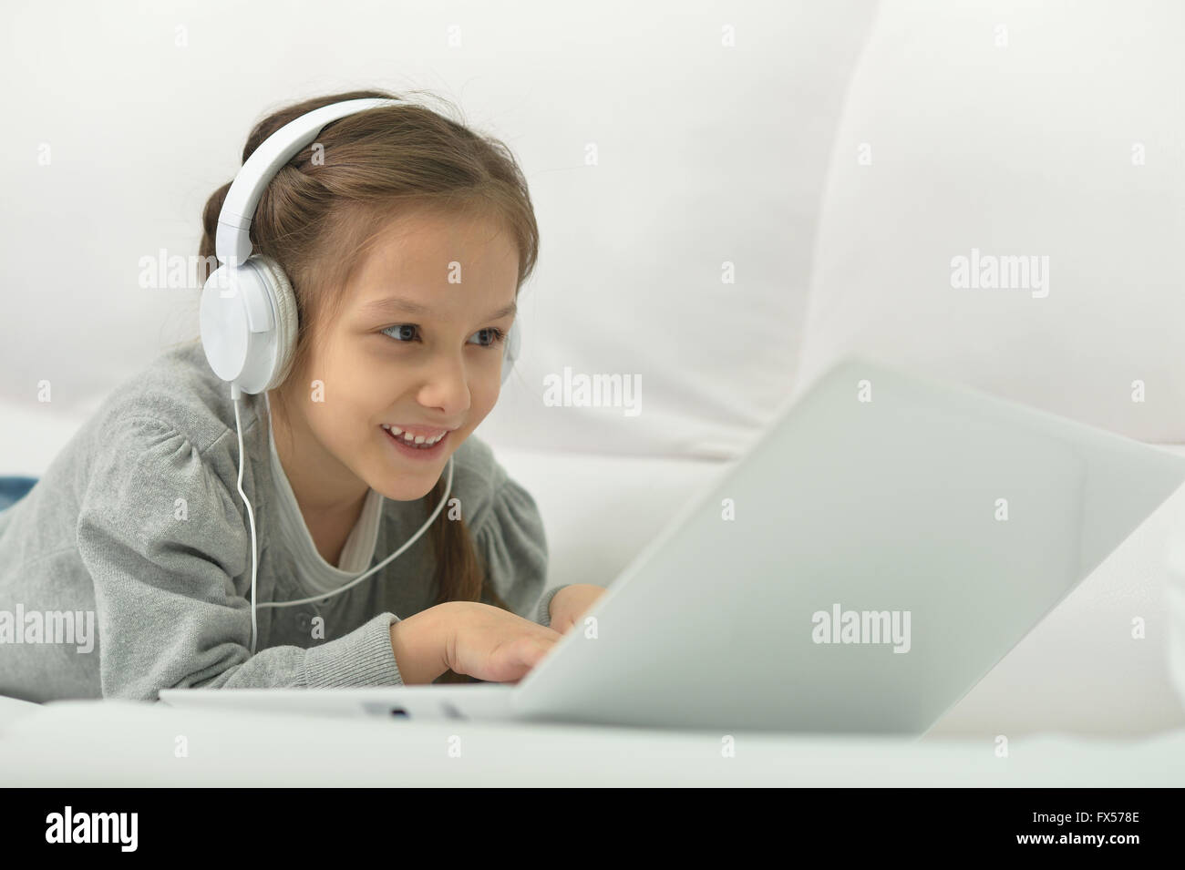 smiling little girl with laptop computer Stock Photo - Alamy