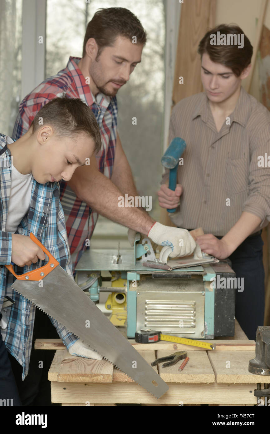 men and boy doing repair at home Stock Photo - Alamy