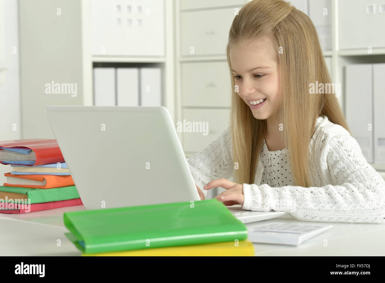 Cute little girl and laptop Stock Photo - Alamy