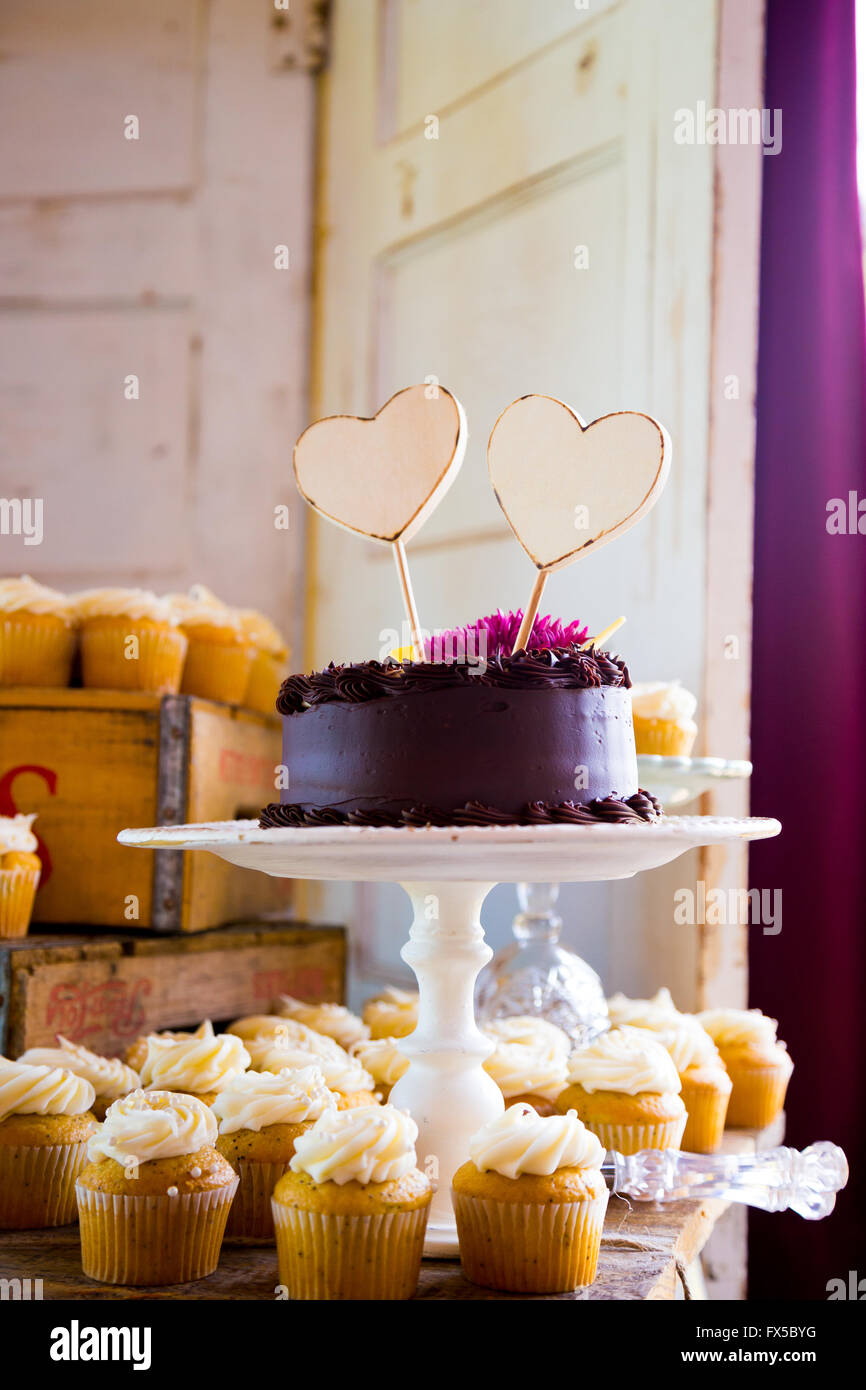 Personal sized chocolate wedding cake at a reception Stock Photo - Alamy