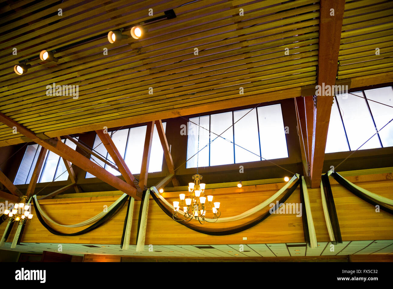 Craftsman style event hall ceiling detail along with some chandeliers ...