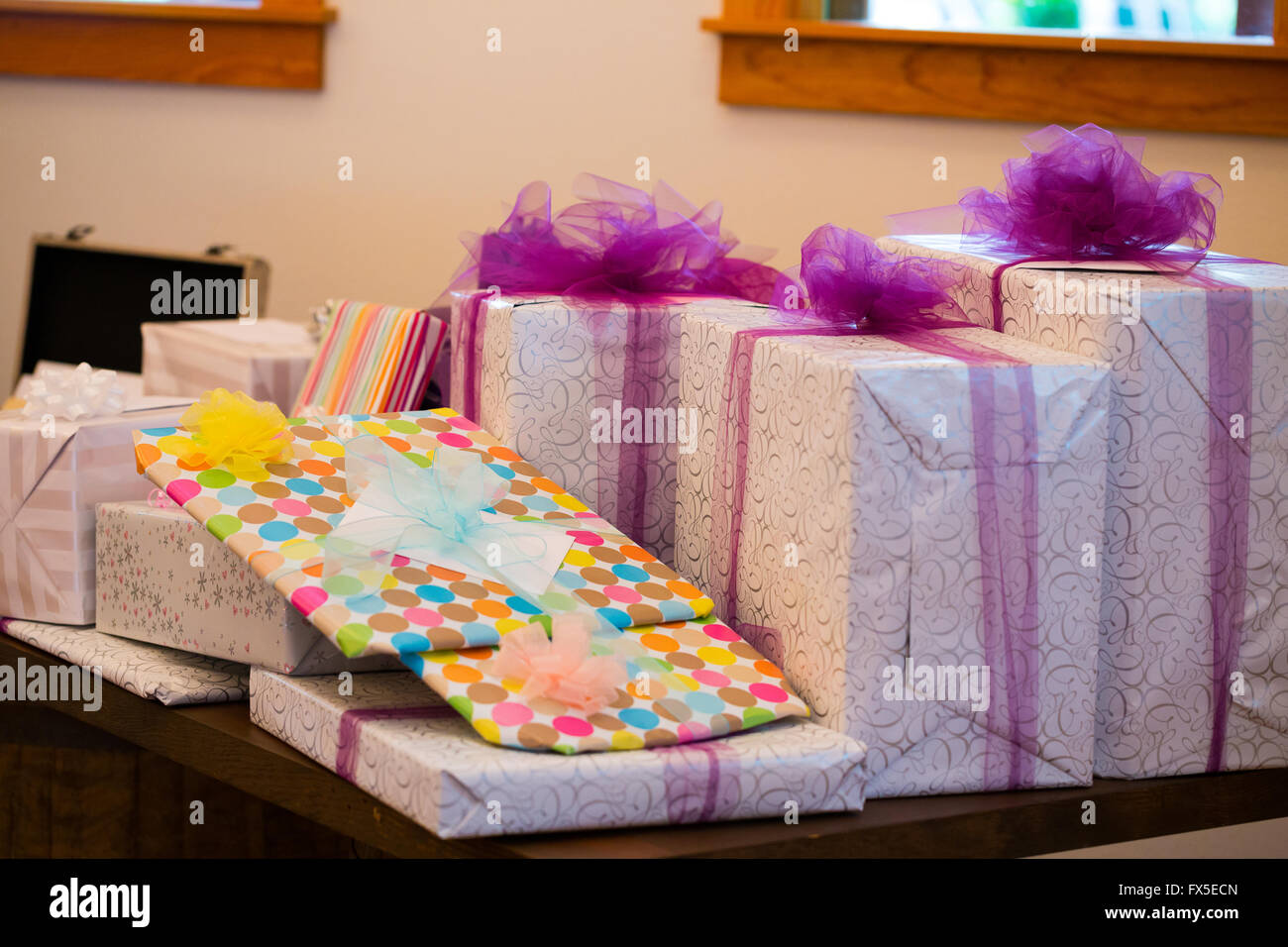Gift table full of wedding day presents Stock Photo - Alamy