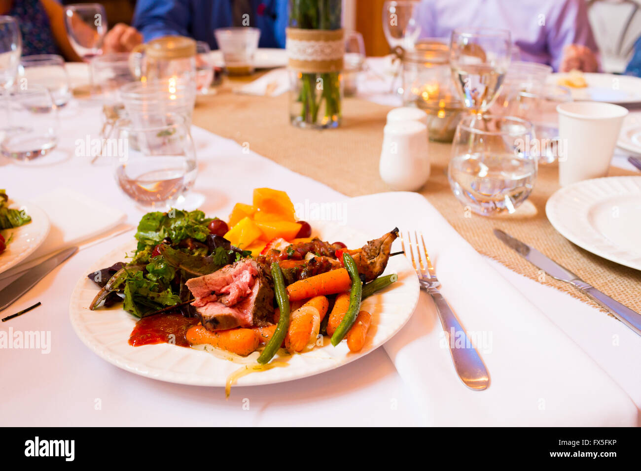 A sit down dinner for a wedding reception meal at a table Stock Photo ...