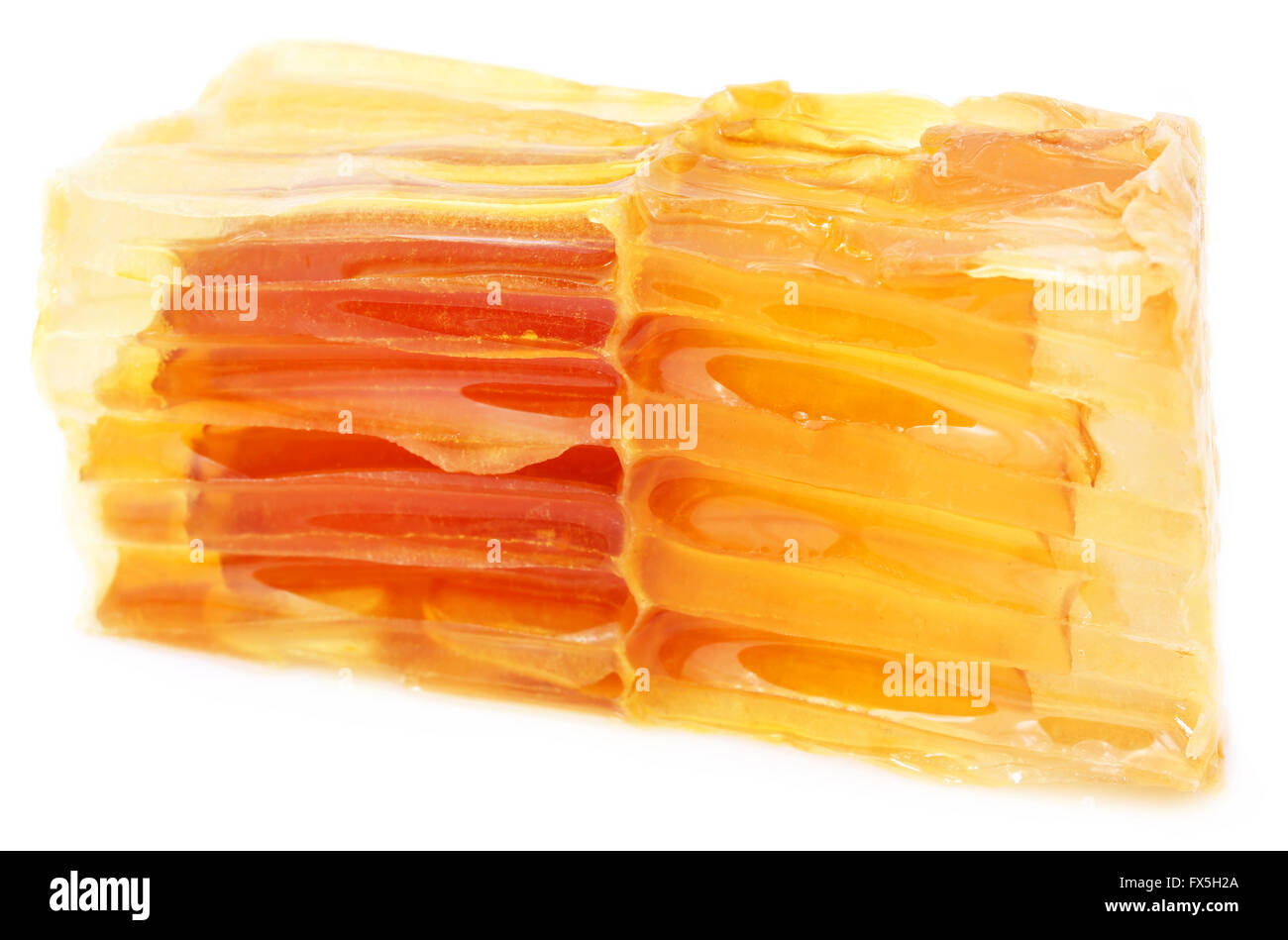 Honey comb over white background Stock Photo - Alamy