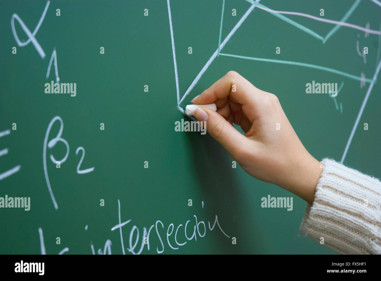 Teacher Writing On Blackboard Stock Photos & Teacher Writing On ...
