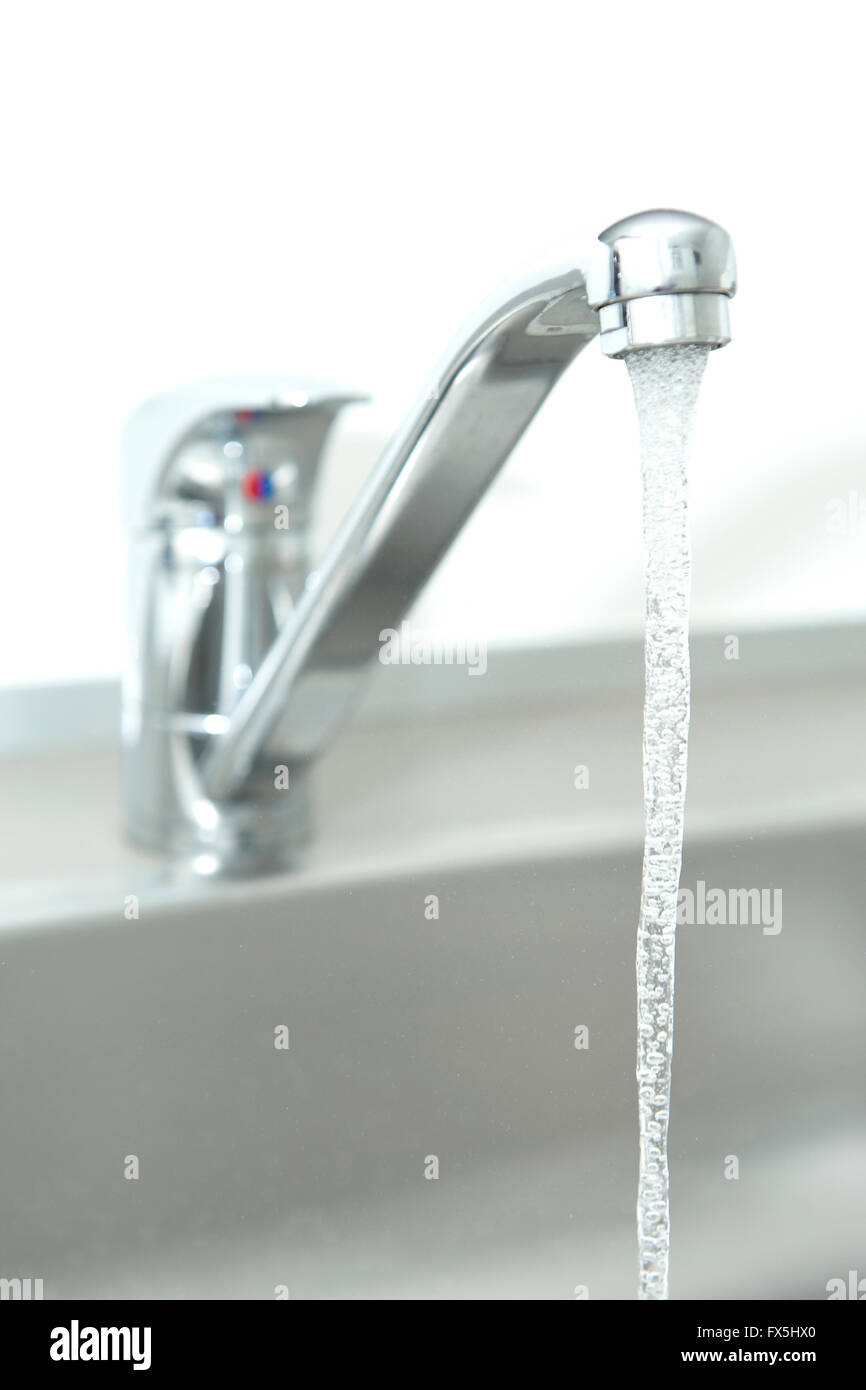 Closeup shoot of a running water tap Stock Photo - Alamy