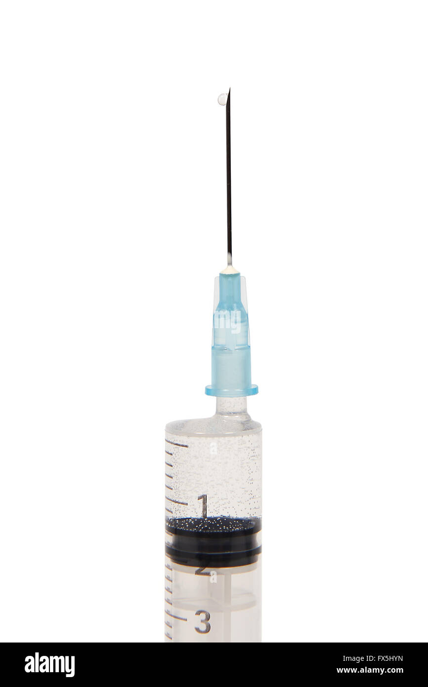 Closeup of a plastic medical syringe, fitted with a detachable ...