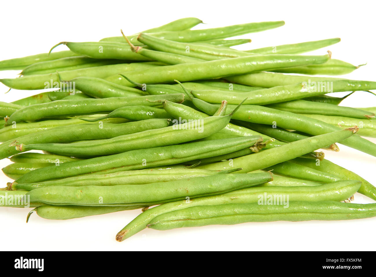 Ecological common green beans on a white background Stock Photo - Alamy