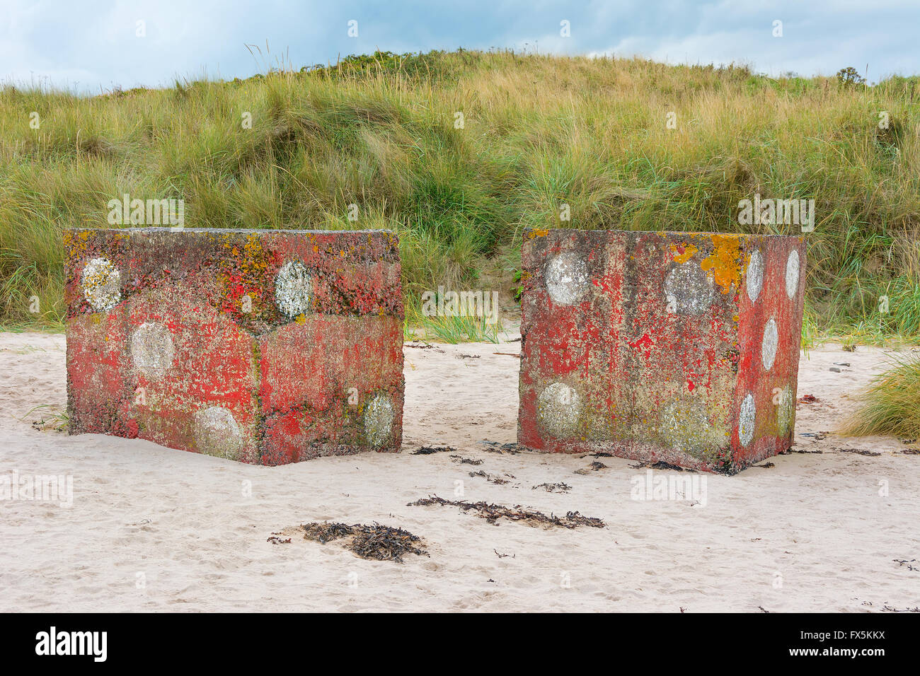 Large concrete dice near Bamburgh Castle England Stock Photo - Alamy