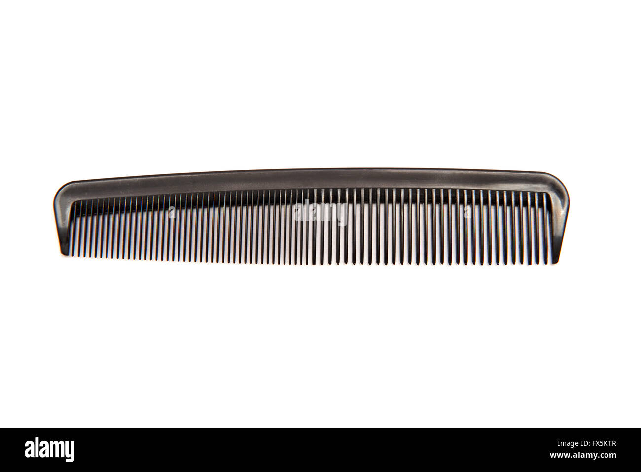 Black plastic comb on a white background Stock Photo - Alamy