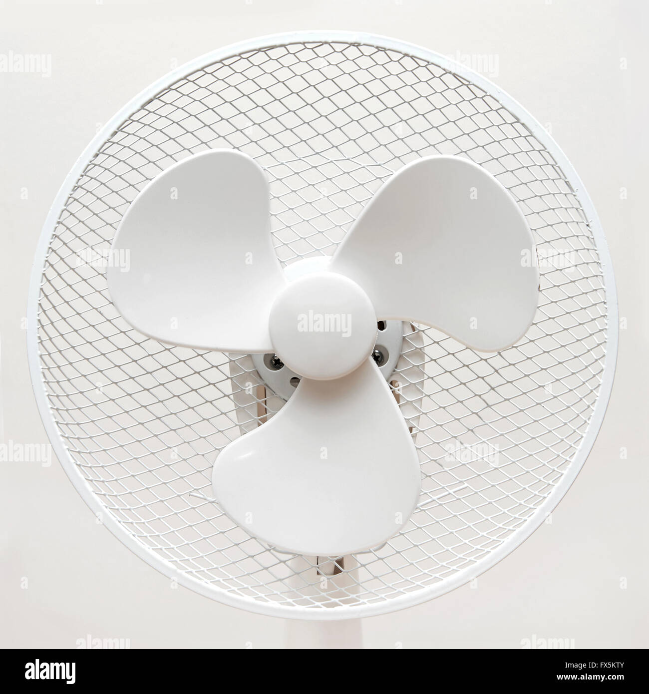 Closeup of a white mechanical table fan Stock Photo - Alamy