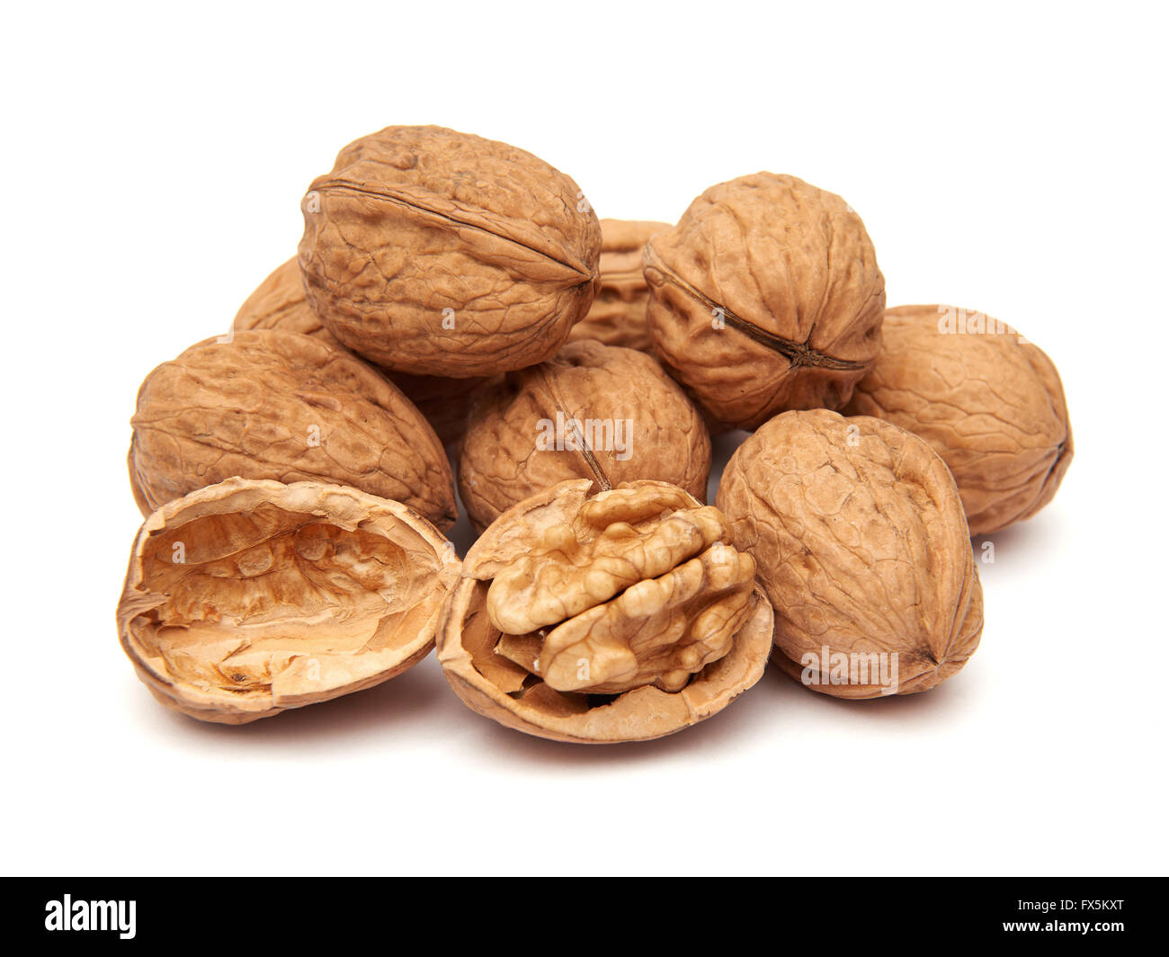 Closeup of common walnuts on a white background Stock Photo - Alamy