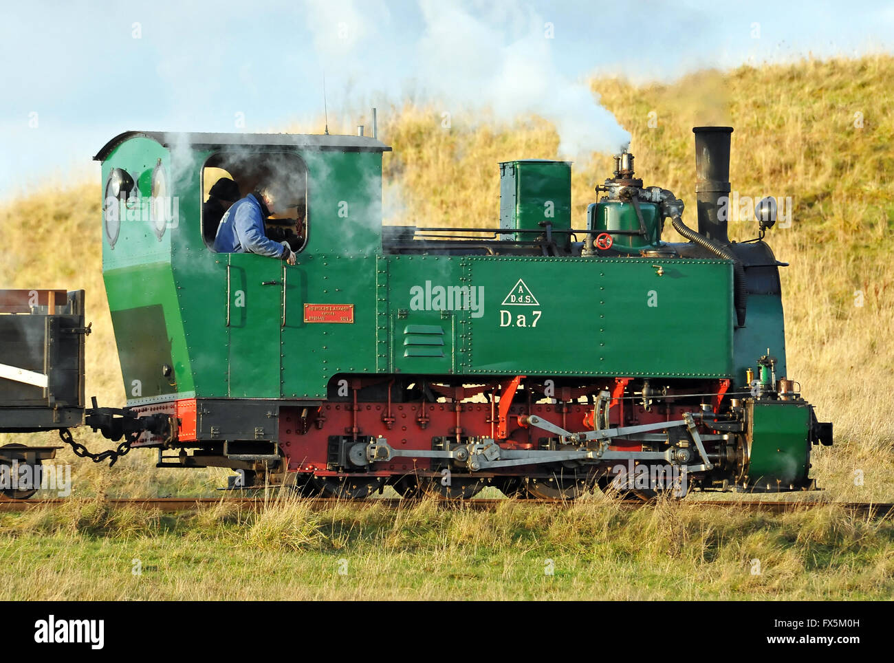 Old green steam train driving Stock Photo - Alamy