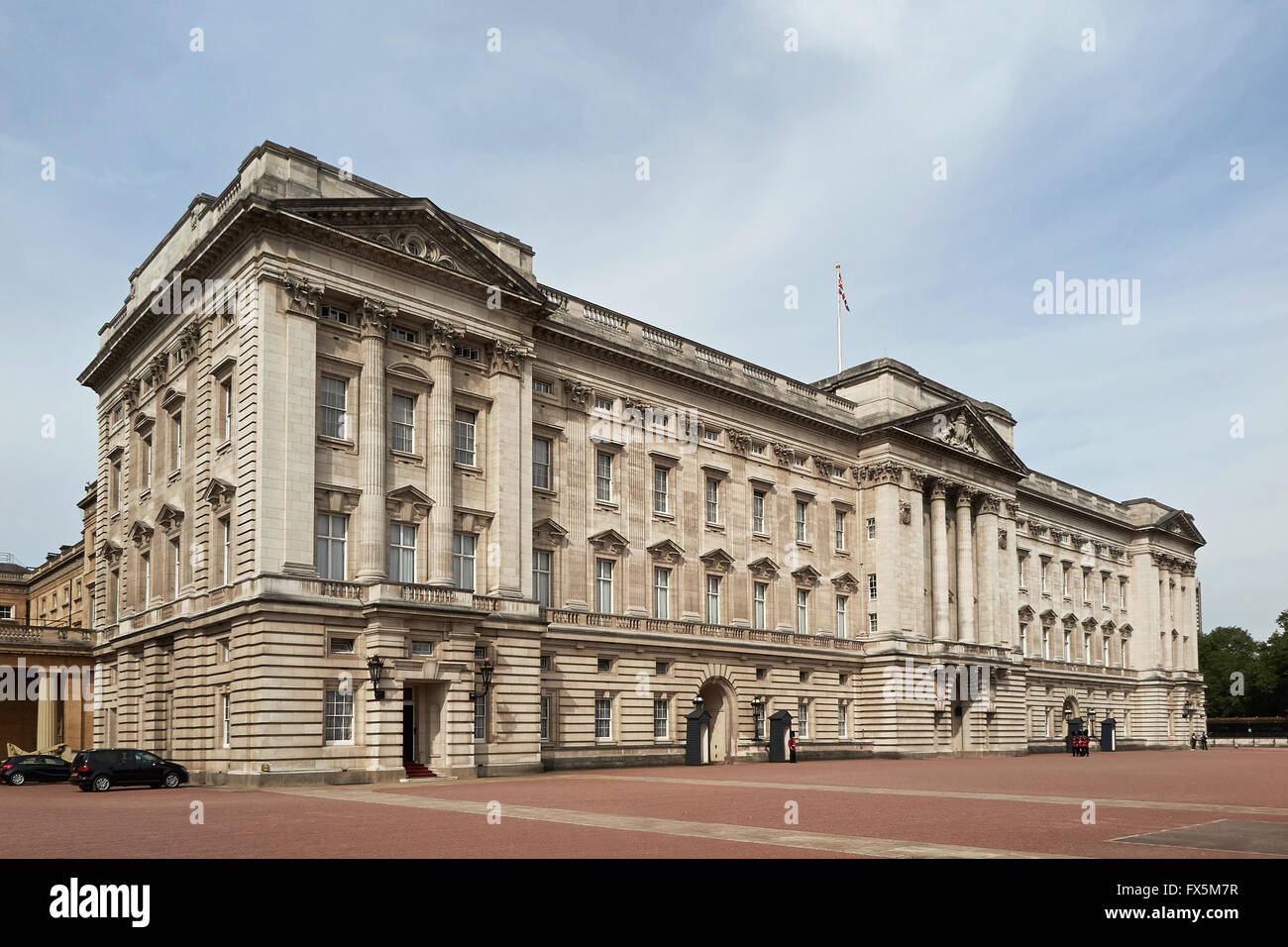 Buckingham Palace in London seen from the side with blue skies in the ...