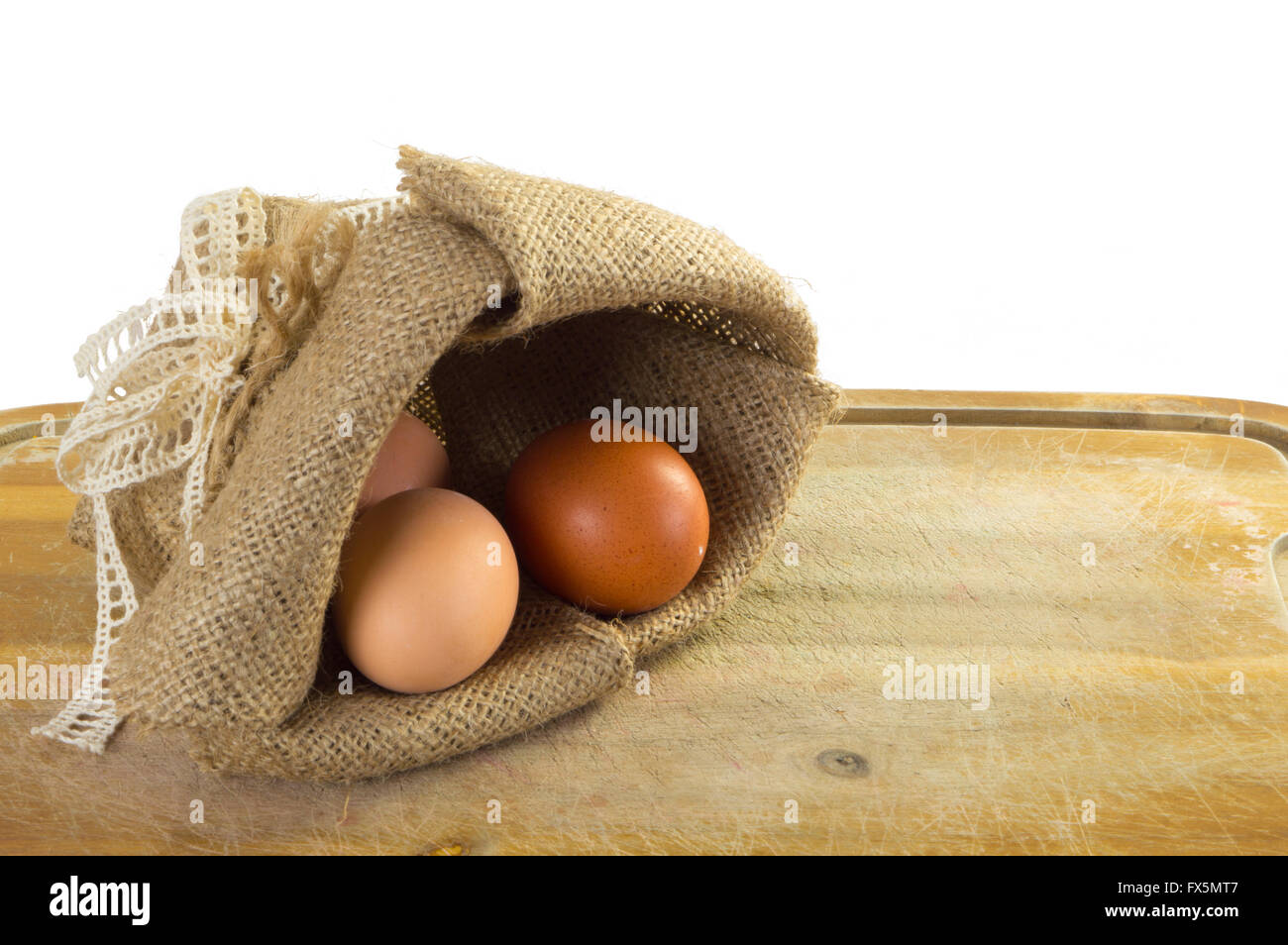 Open sack of eggs isolated on white background Stock Photo - Alamy