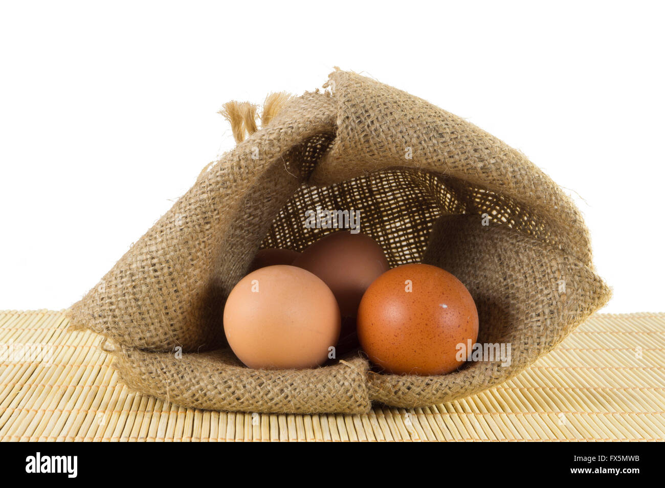Open sack of eggs isolated on white background Stock Photo - Alamy
