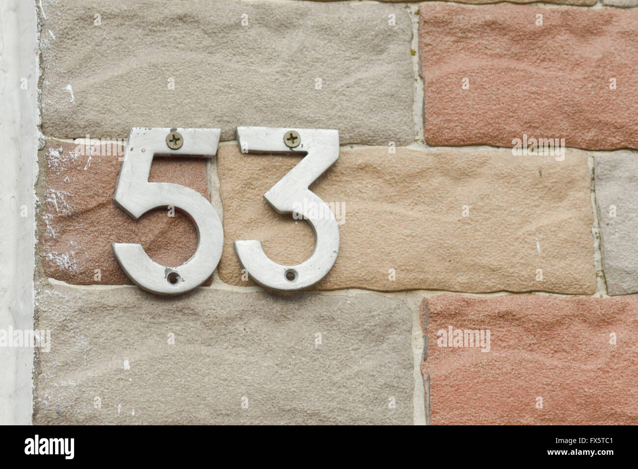 House number 53 sign on wall Stock Photo - Alamy