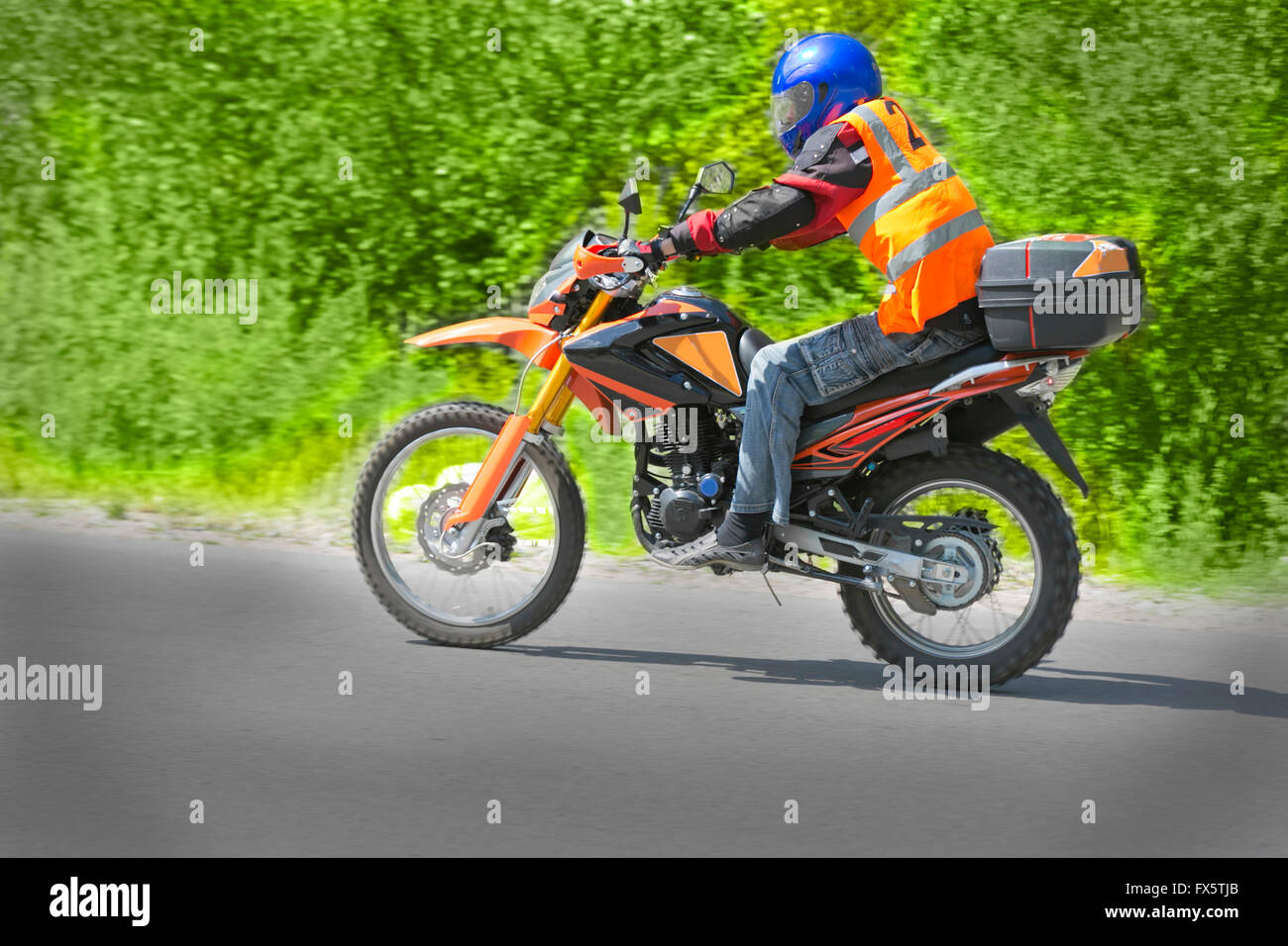 motorcyclist biker fast riding Stock Photo - Alamy