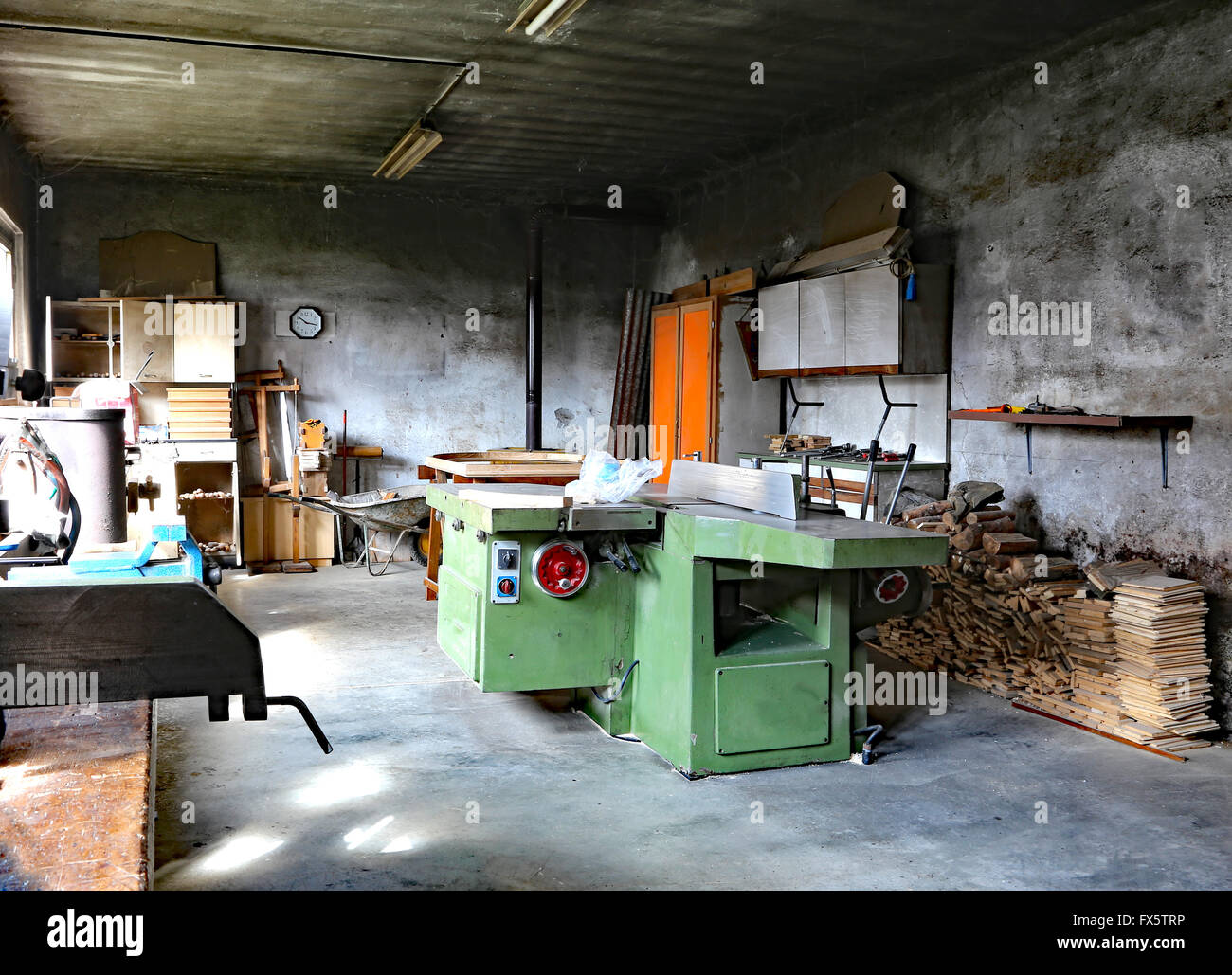 disused carpentry with the large machine to cut the wooden planks Stock ...
