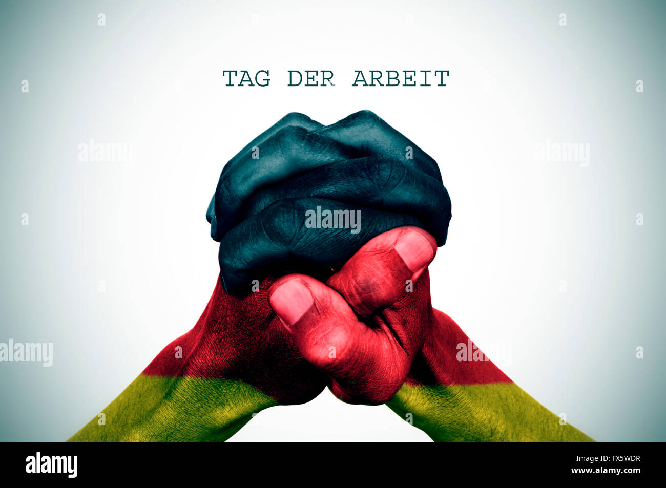 man hand patterned with the flag of Germany put together and the text ...