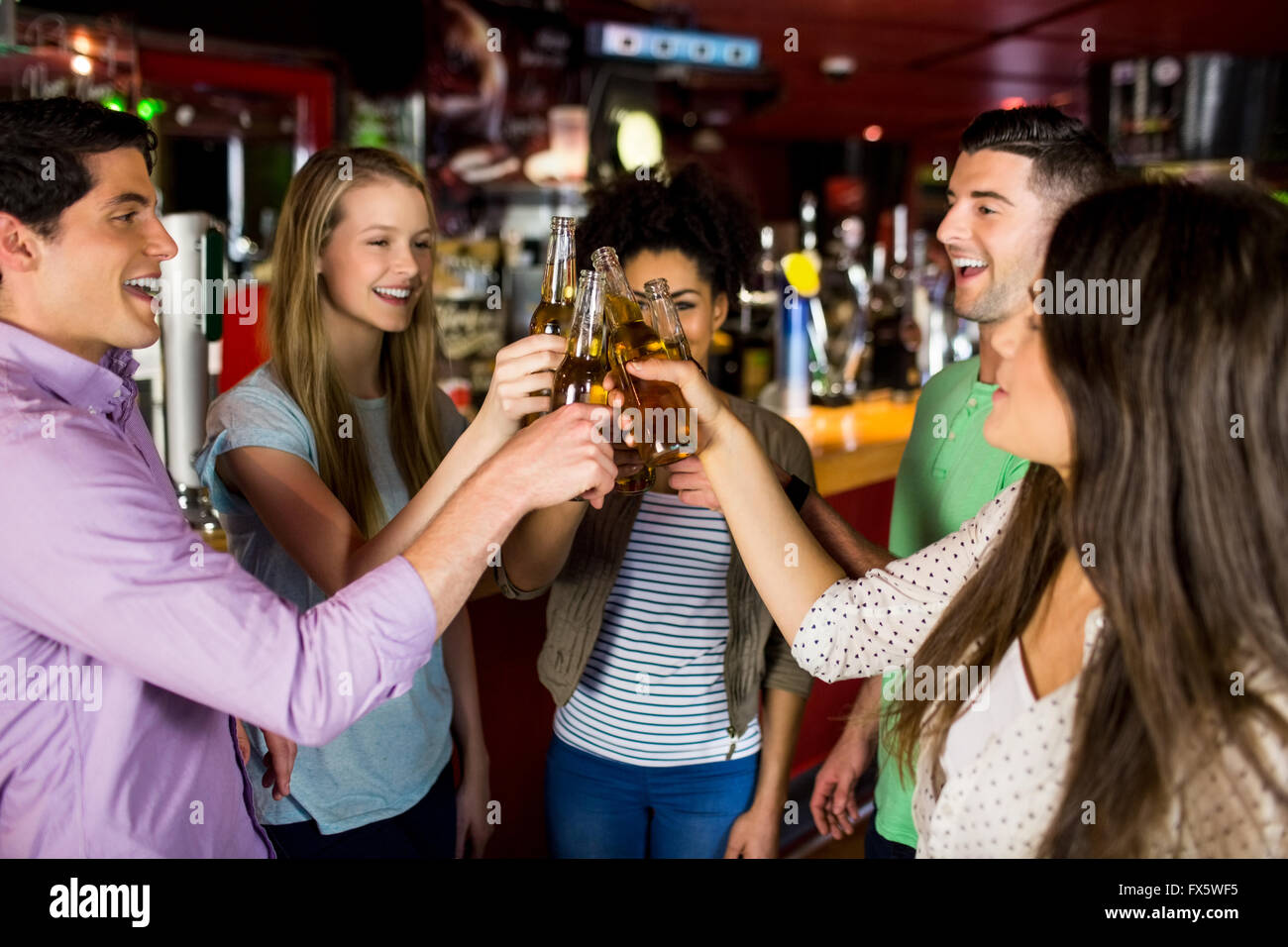 Friends toasting with beer Stock Photo - Alamy