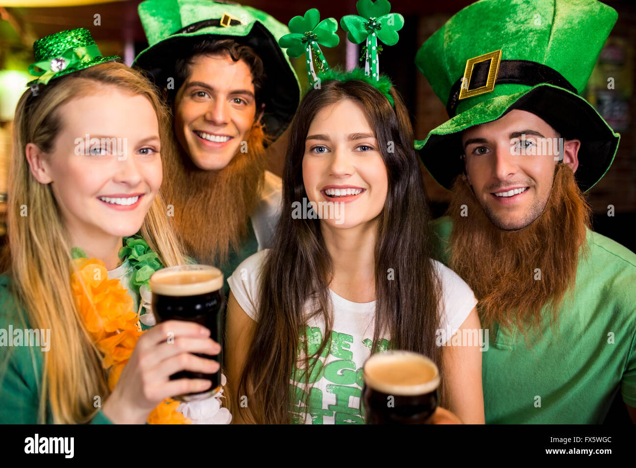 Smiling friends with Irish accessory Stock Photo - Alamy