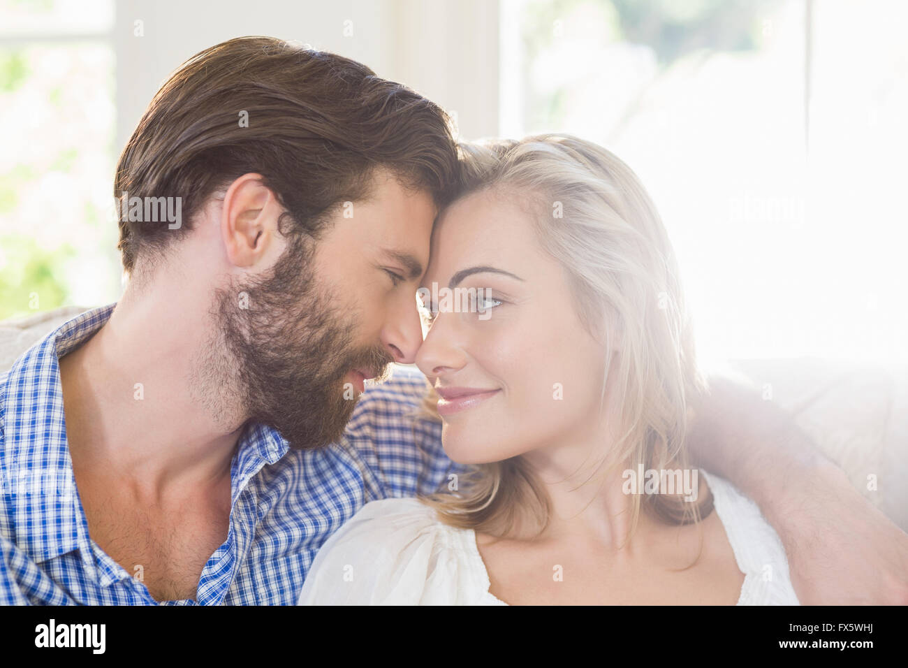 Romantic couple looking face to face Stock Photo - Alamy