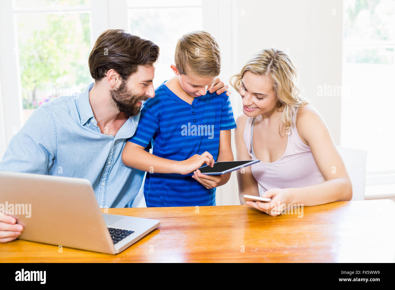 Family tablet smartphone table hi-res stock photography and images - Alamy